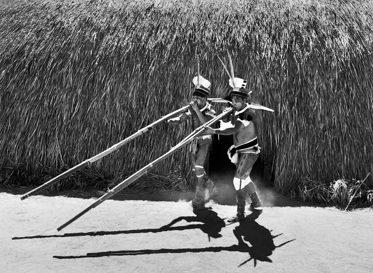 In the Waurá village during the festival of Kuarup, two men playing ...